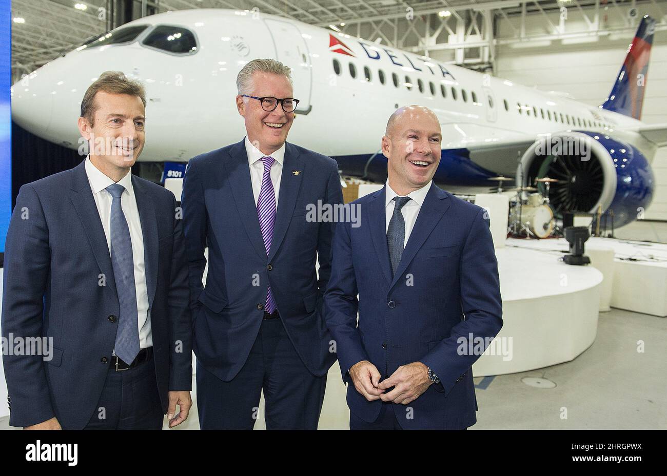 Delta Air Lines CEO Ed Bastian, centre, talks with Airbus President of ...