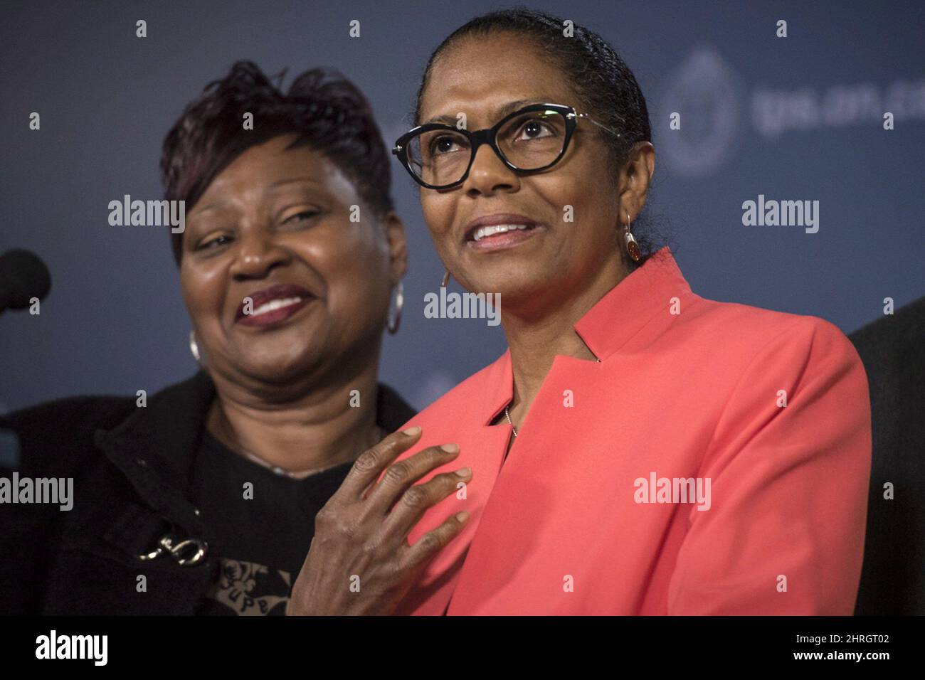 Lyneth Mann-Lewis, left, of Brampton, Ont., discusses what it was like ...