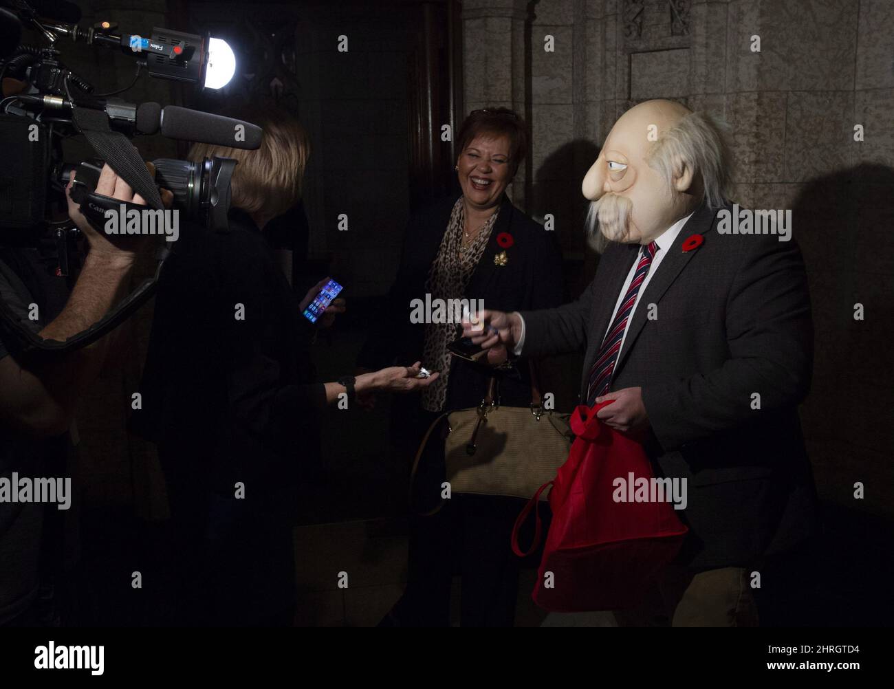 Liberal MP Bryan May hands out candy as he walks the halls of ...