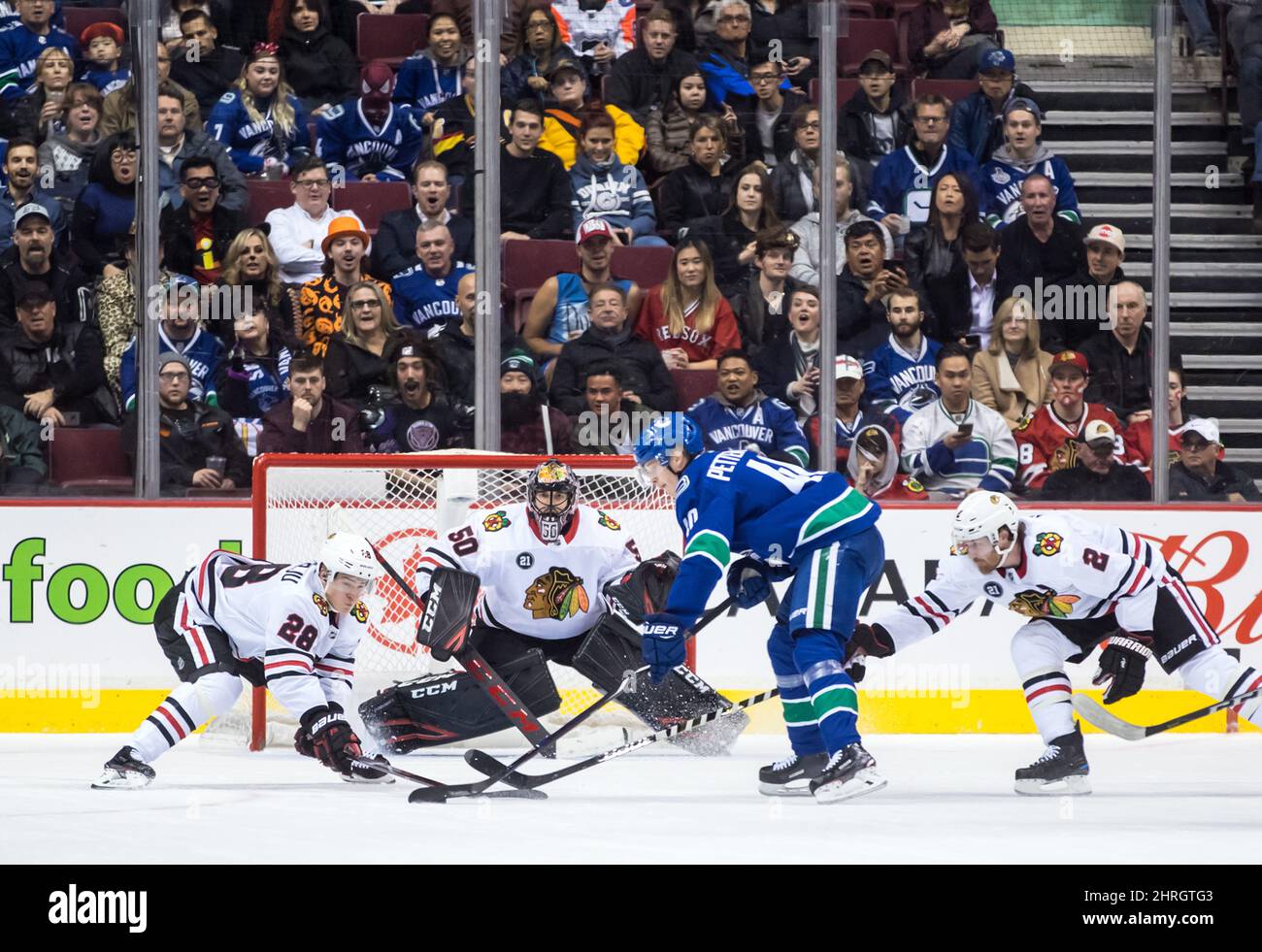 Vancouver Canucks' Elias Pettersson (40), of Sweden, attempts a shot on ...