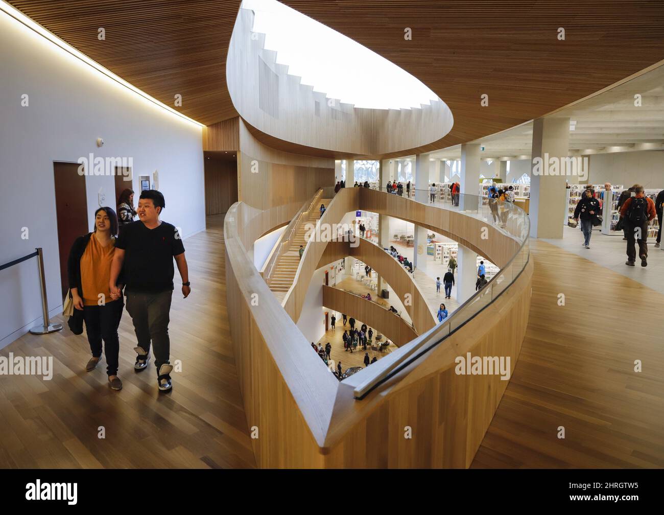 Visitors explore the new Calgary Library following its opening in ...