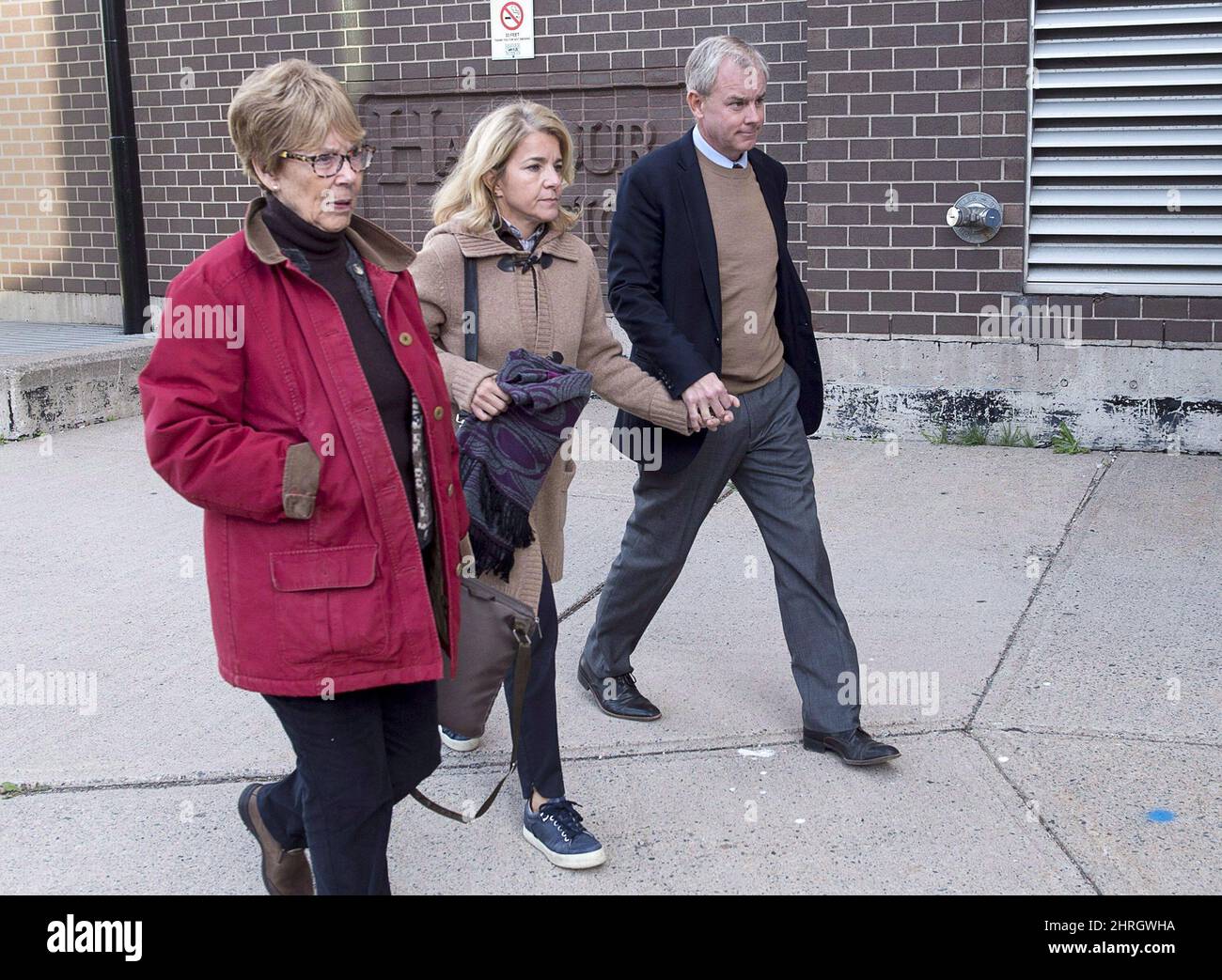 Dennis Oland, right, his wife Lisa and mother Connie, left, arrive at ...