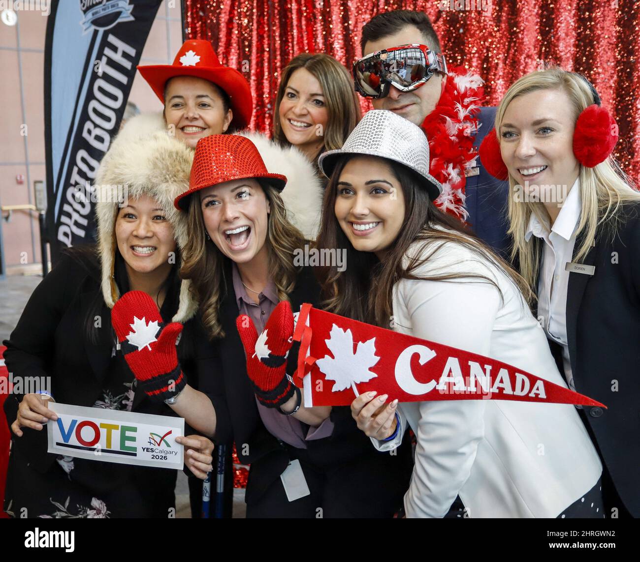 Calgary 2026 Olympic bid supporters pose in a photo booth during a ...