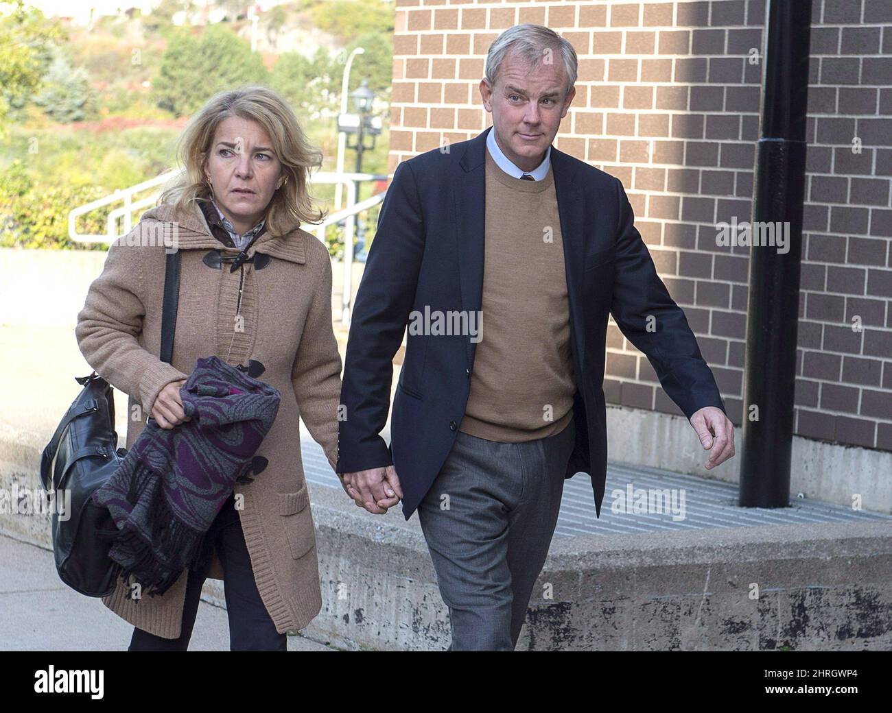 Dennis Oland and his wife Lisa arrive at Harbour Station arena in Saint ...