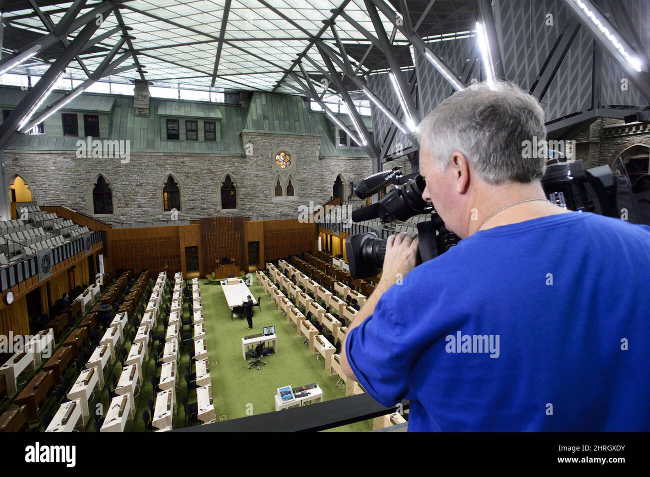 A cameraman records video of the new temporary House of Commons is ...