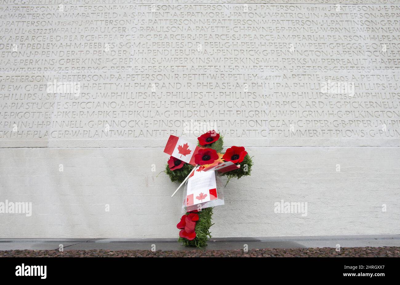A poppy cross sits beneath names of fallen Canadian soldiers at the ...