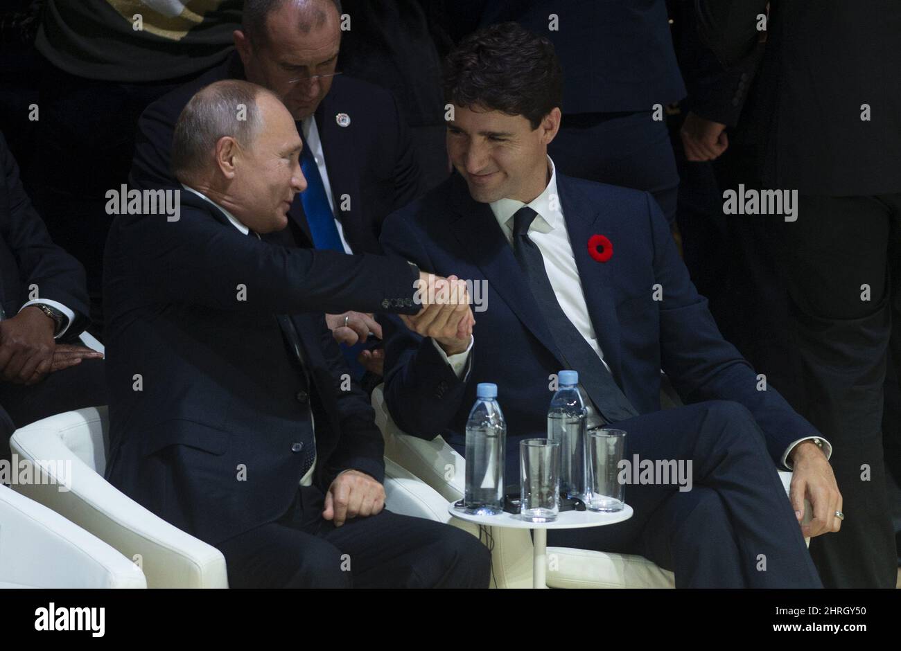 Canadian Prime Minister Justin Trudeau shakes hands with Russian ...