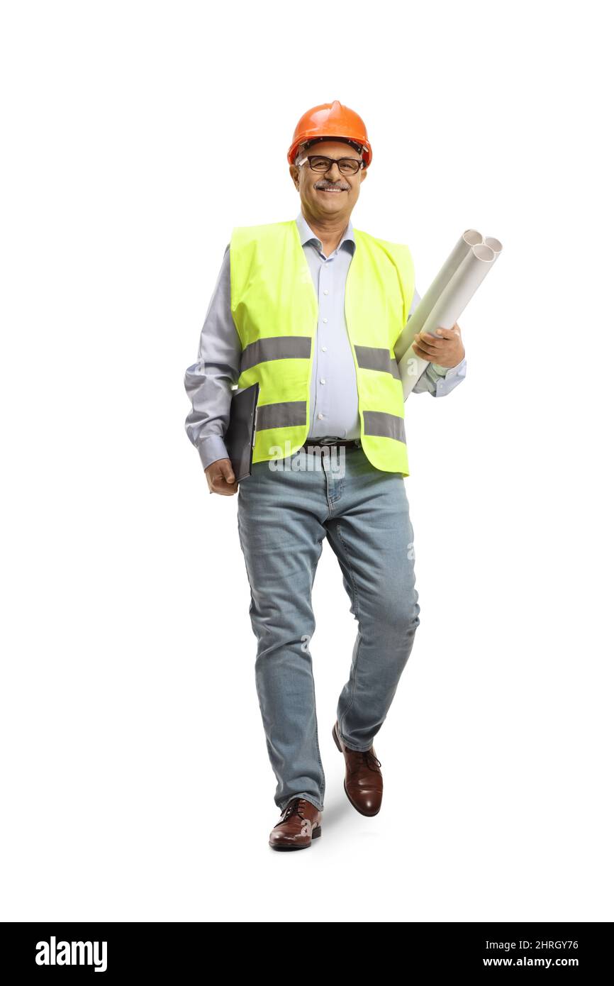 Full length portrait of a mature male engineer holding blueprints and ...