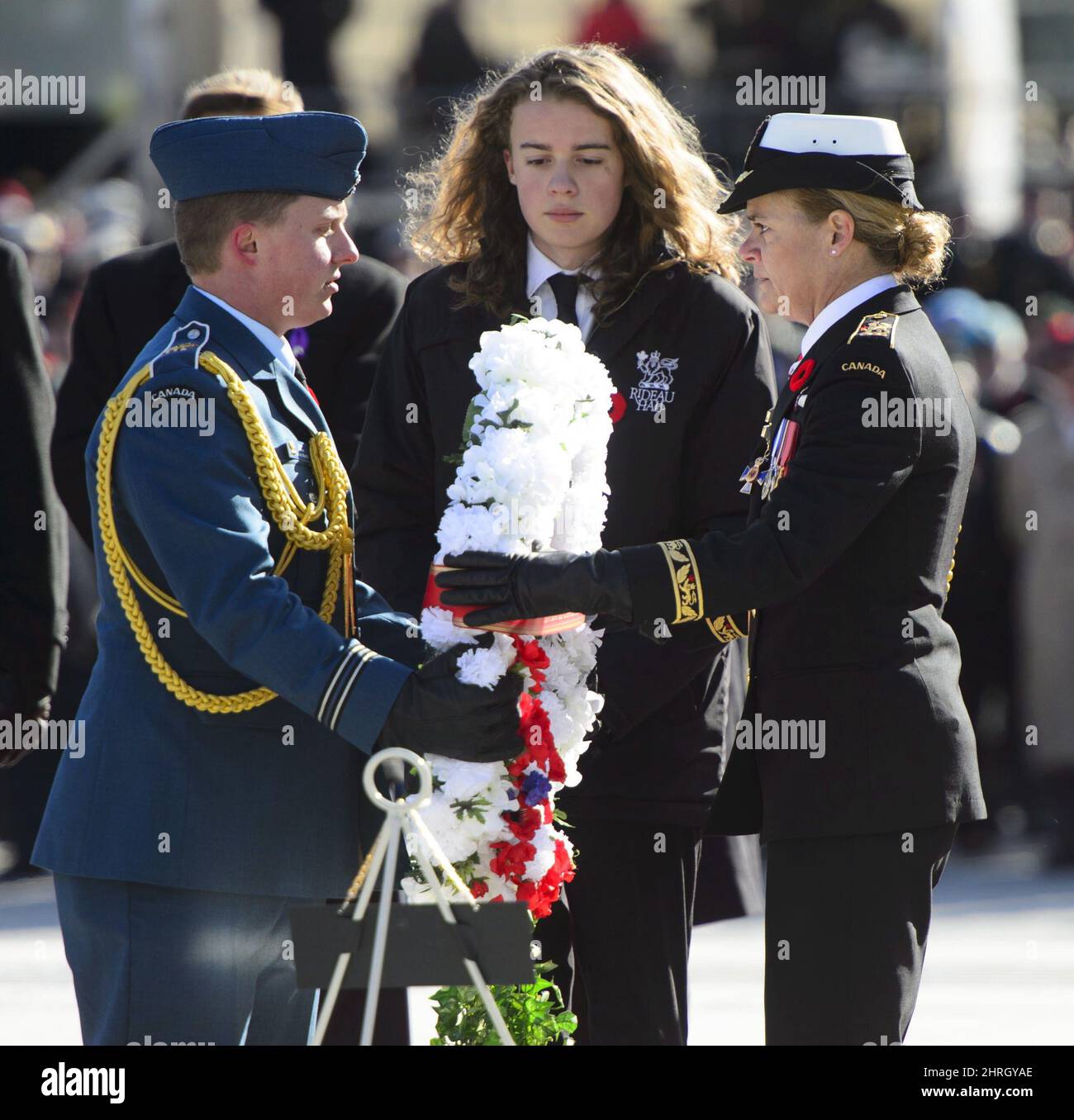 Governor General Julie Payette places a wreath with her son Laurier Payette-Flynn during ...