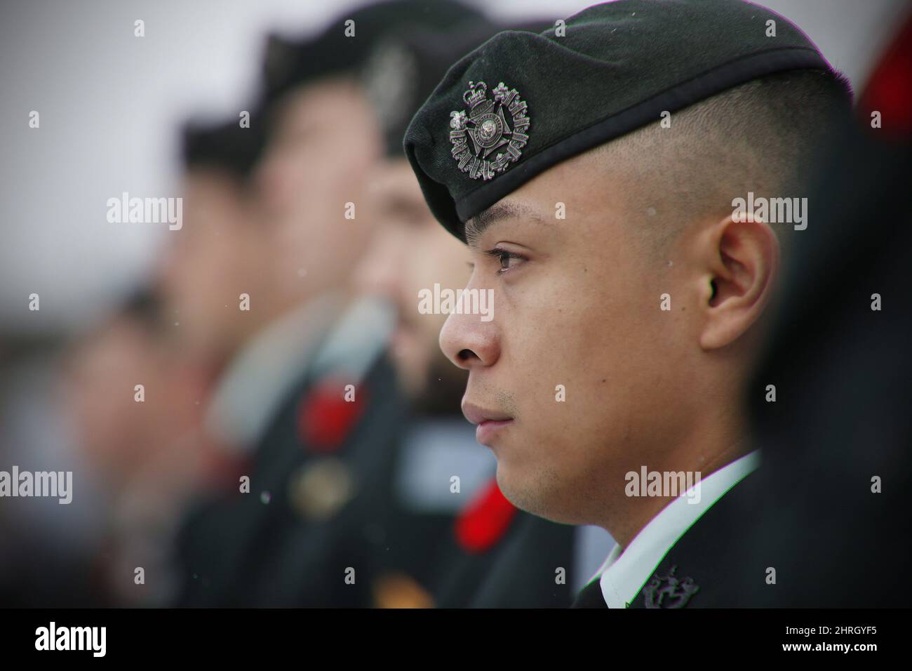 Members of the Royal Winnipeg Rifles stand on guard at a cenotaph ...