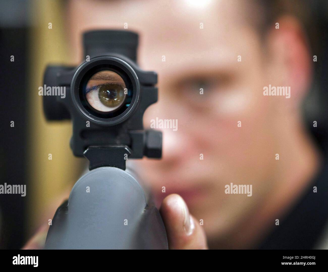 Patrick Deegan, a senior range officer at the Shooting Edge, looks ...