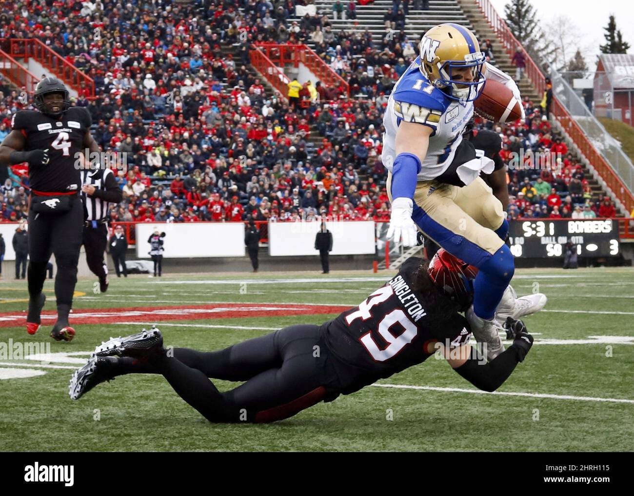 Winnipeg Blue Bombers quarterback Chris Streveler, top, is tackled by ...