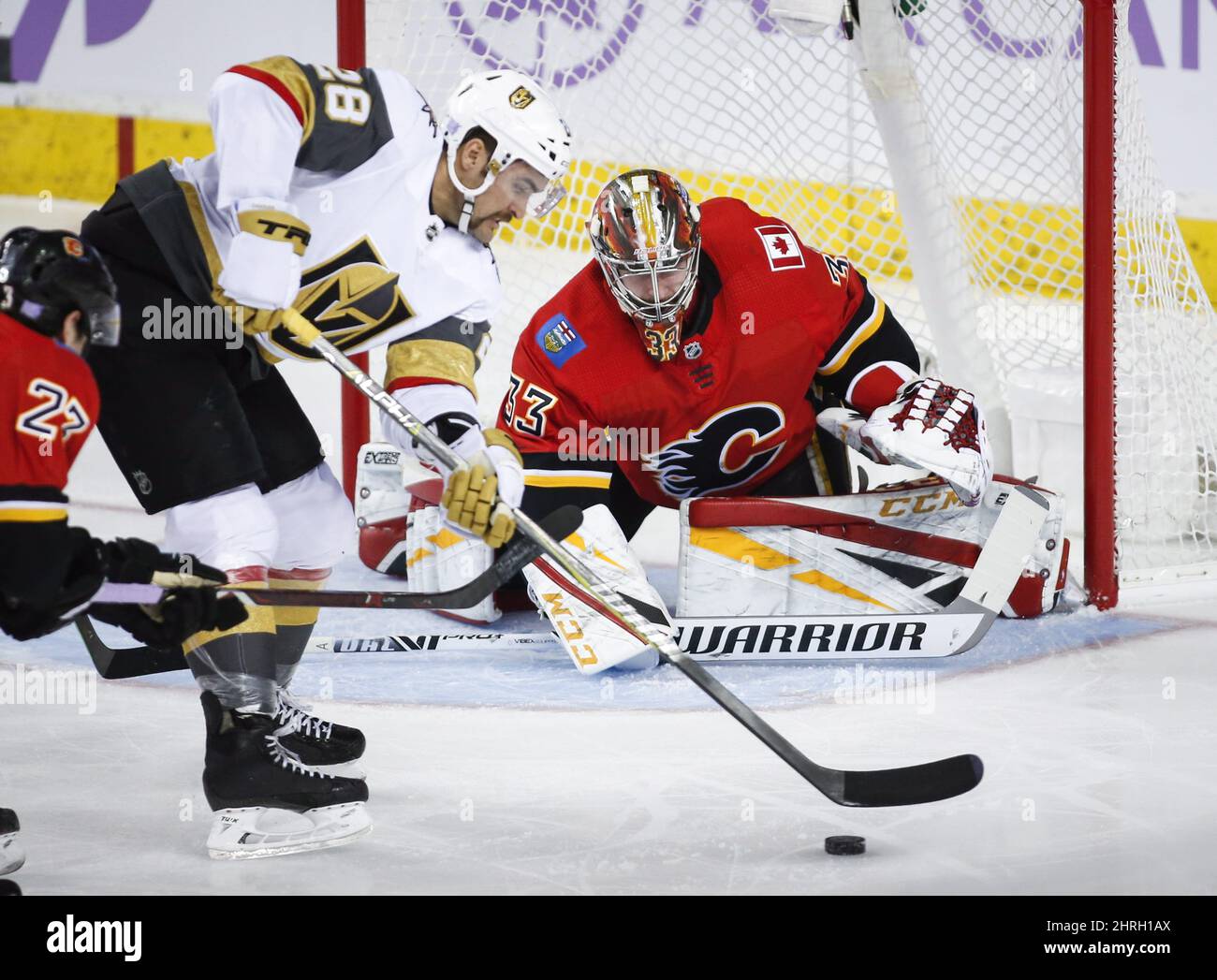 Vegas Golden Knights' William Carrier, left, tries to get the puck past ...
