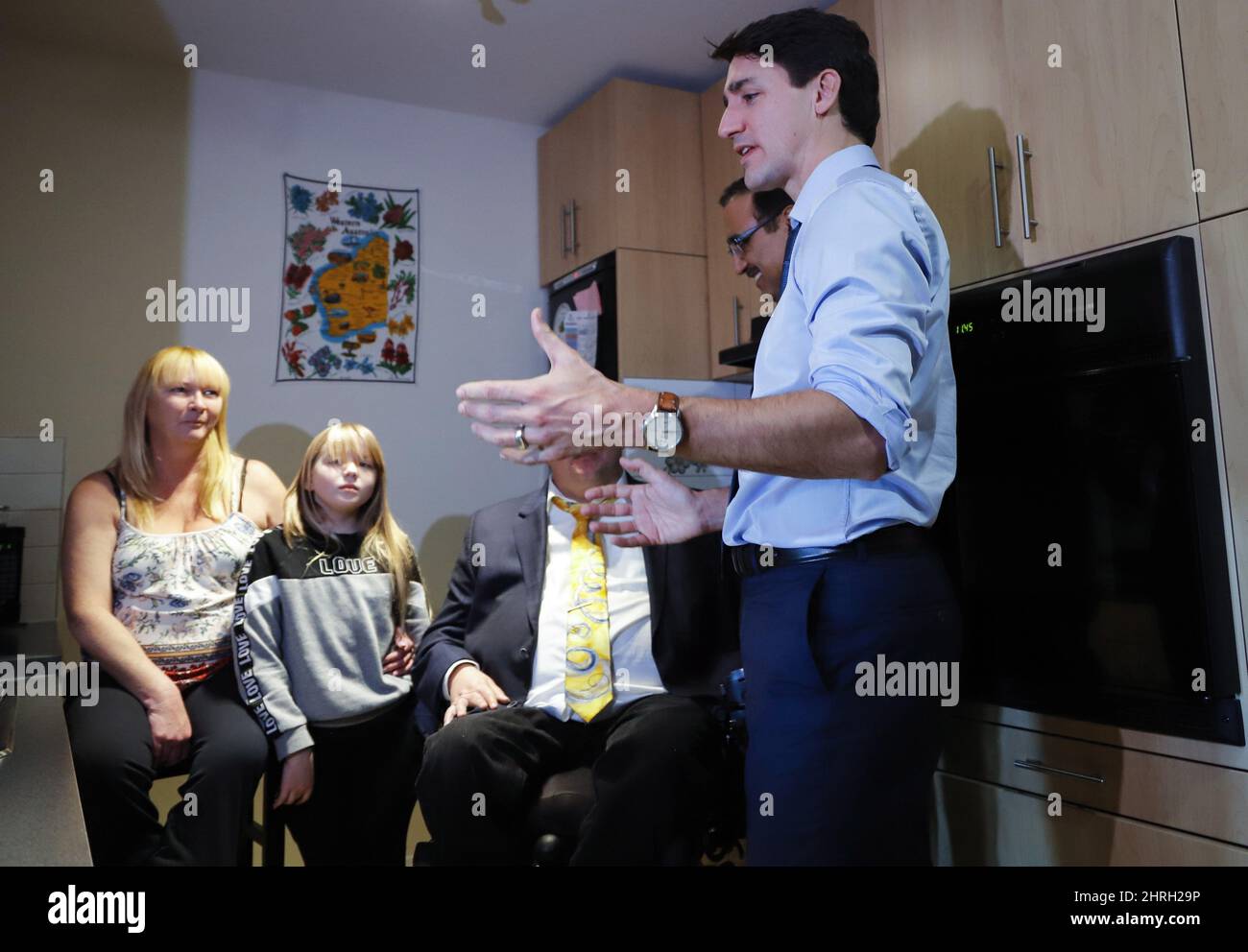 Prime Minister Justin Trudeau, right, speaks with Tracey Hume, left ...