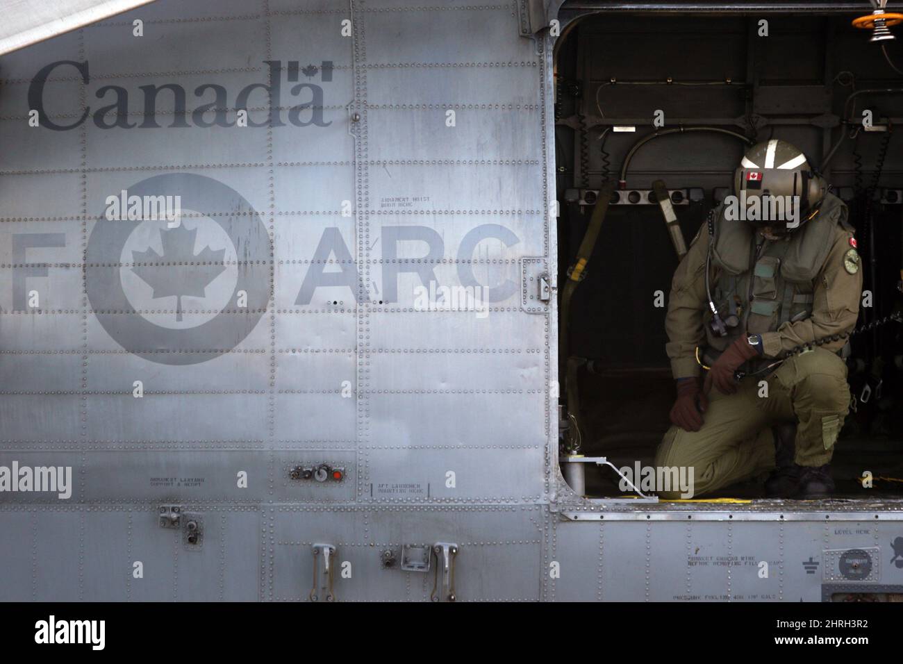 A RCAF crew member prepares for takeoff aboard the CH-124 Sea King ...