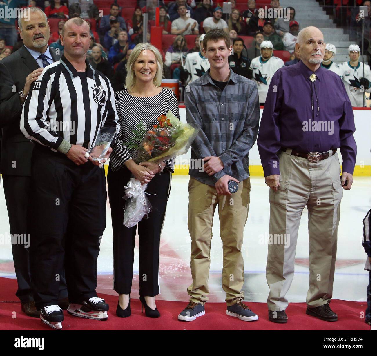 NHL Linesman Derek Nansen (70) stands with family members during a ...