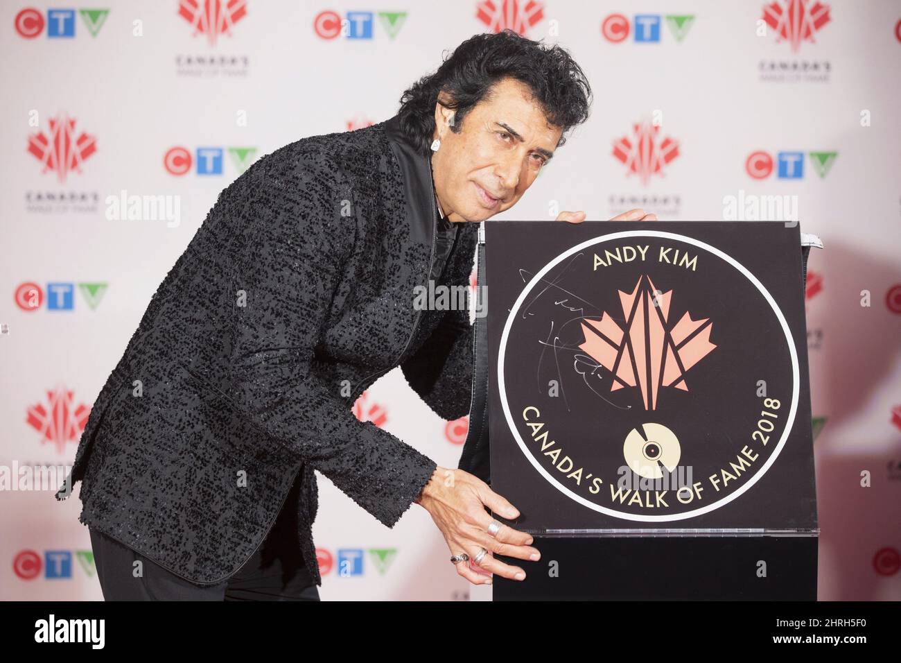 Former singer/songwriter Andy Kim poses for a photo with his star as he ...