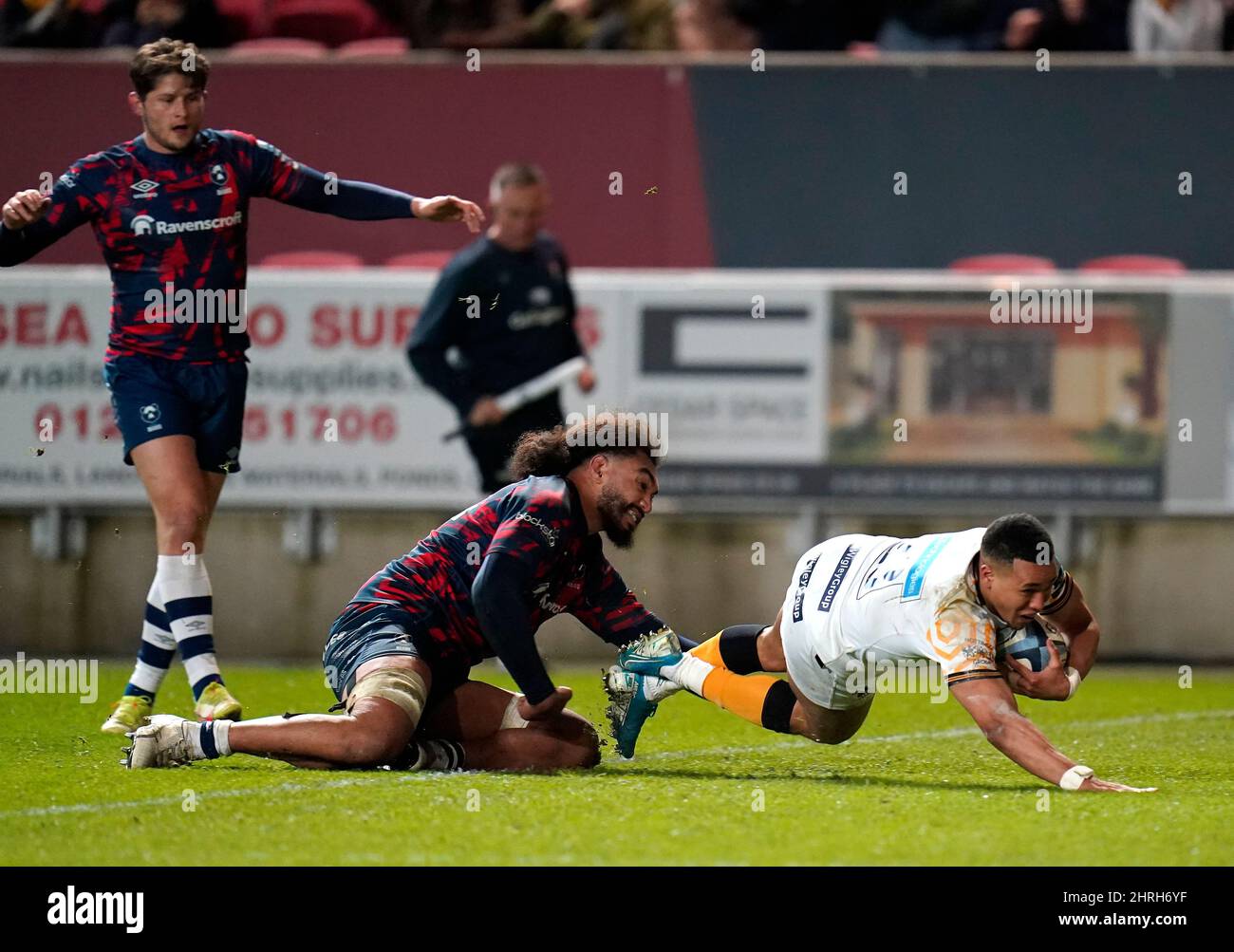 Wasps' Marcus Watson (right) scores his side's third try of the game ...
