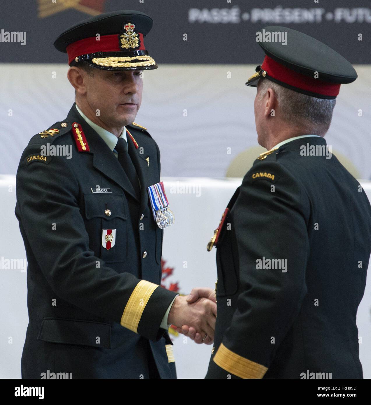 Chief of Defence Staff Jonathan Vance shakes hands with Brig.-Gen. Mark ...