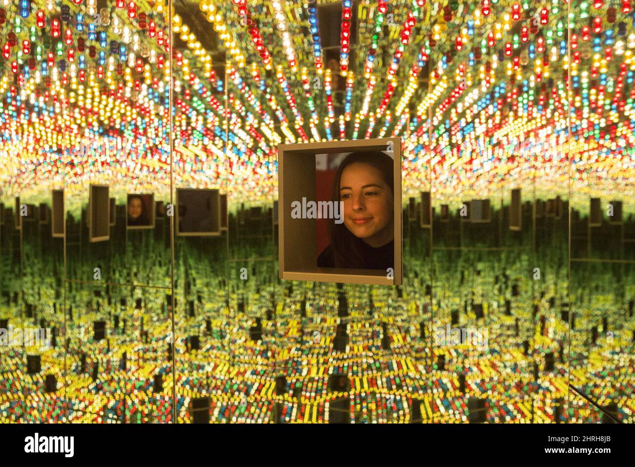 A woman looks at Yayoi Kusama's "Love Forever," part of the "Yayoi ...