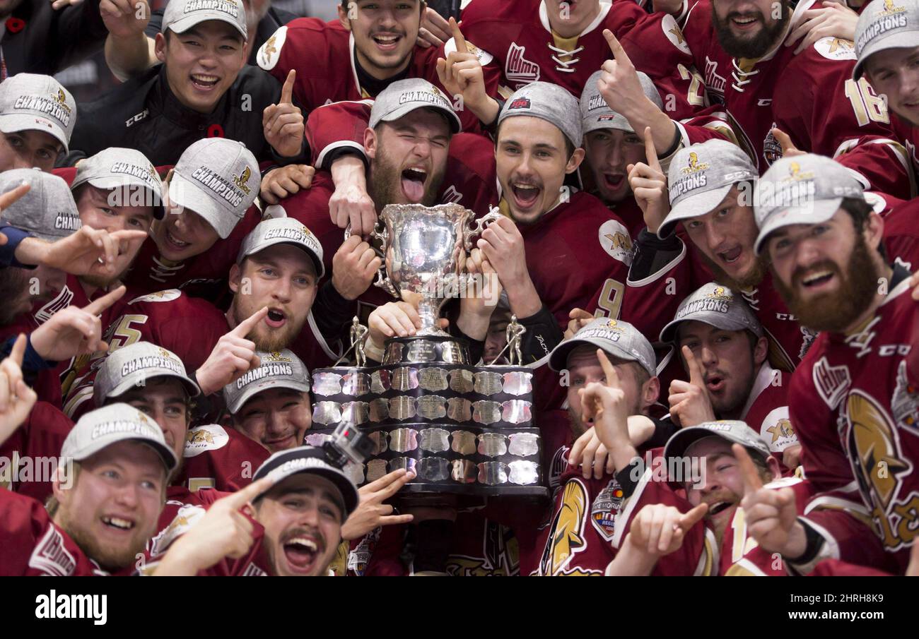 Members of the Acadie-Bathurst Titan pose with the Memorial Cup after ...