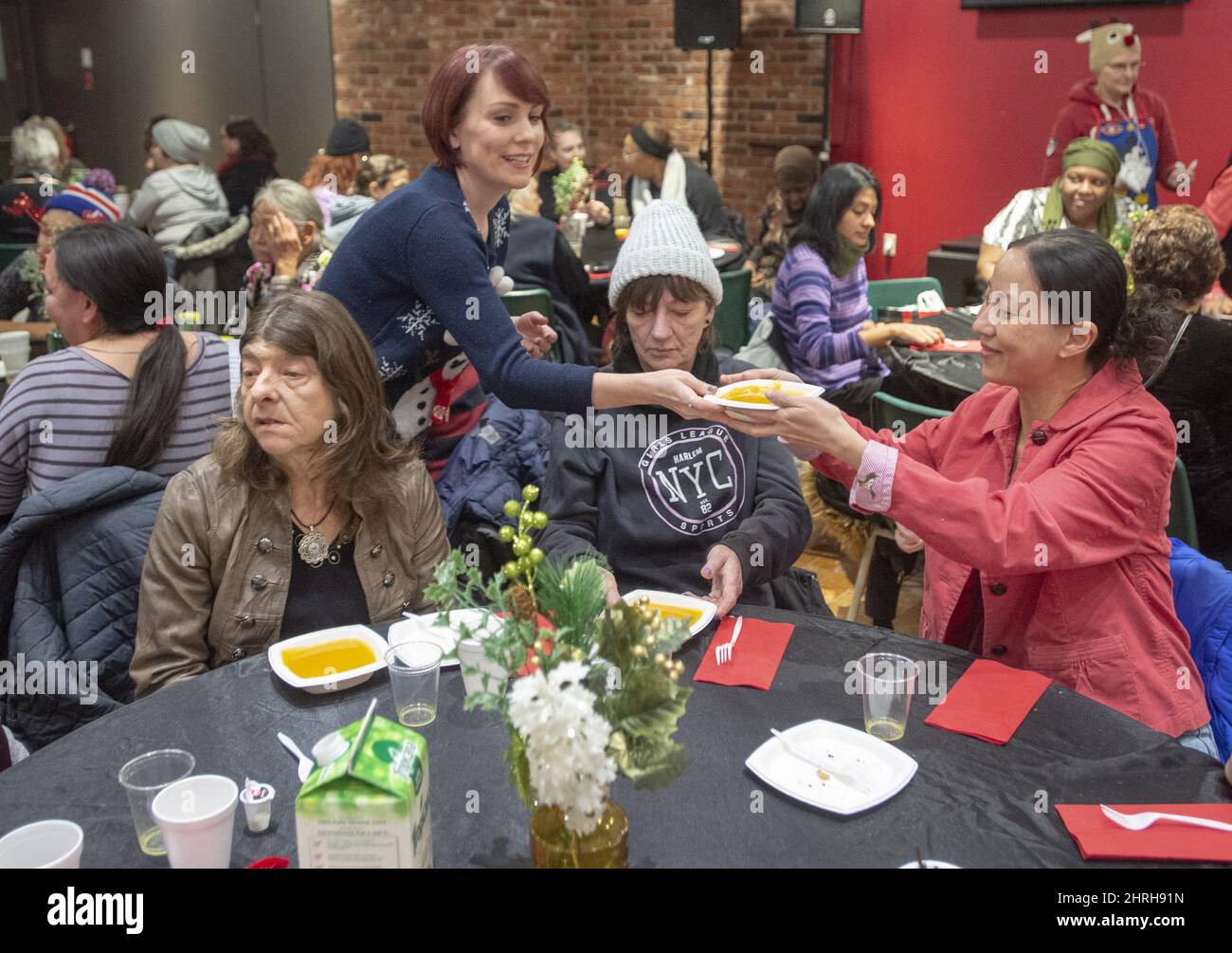 Allison Lemieux serves Christmas dinner at the Chez Doris women's ...