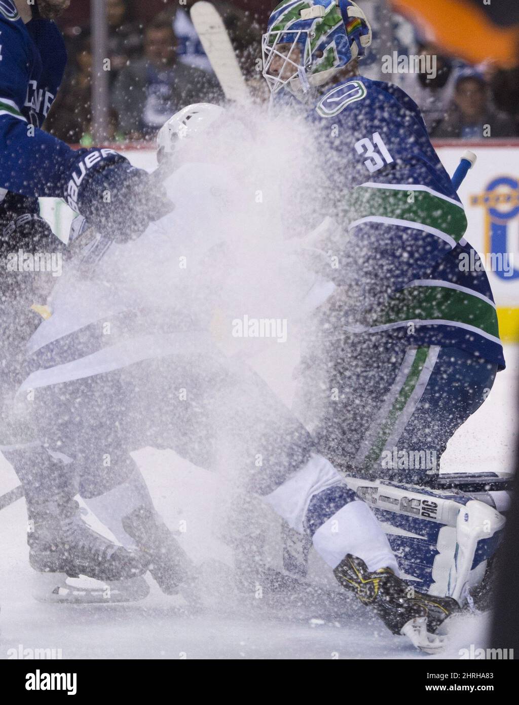 Tampa Bay Lightning center Yanni Gourde (37) sprays Vancouver Canucks ...