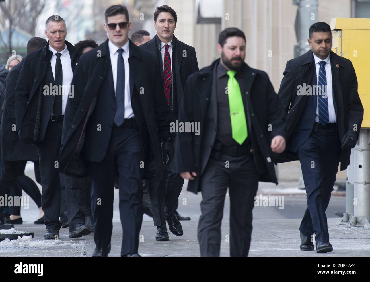 Canadian Prime Minister Justin Trudeau is flanked by security as he ...
