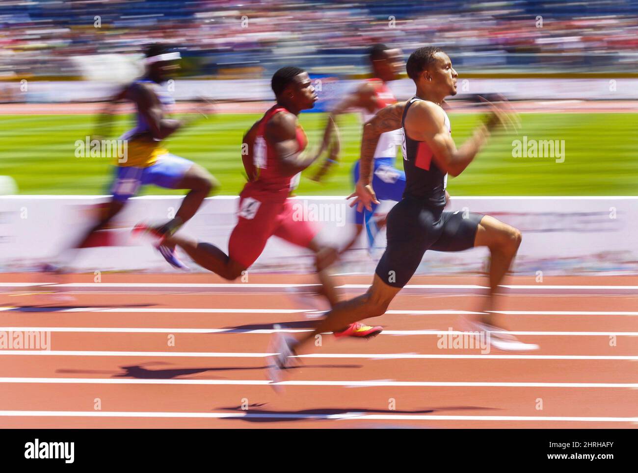 Andre De Grasse, right, of Canada sprints during the men's 200m heats ...
