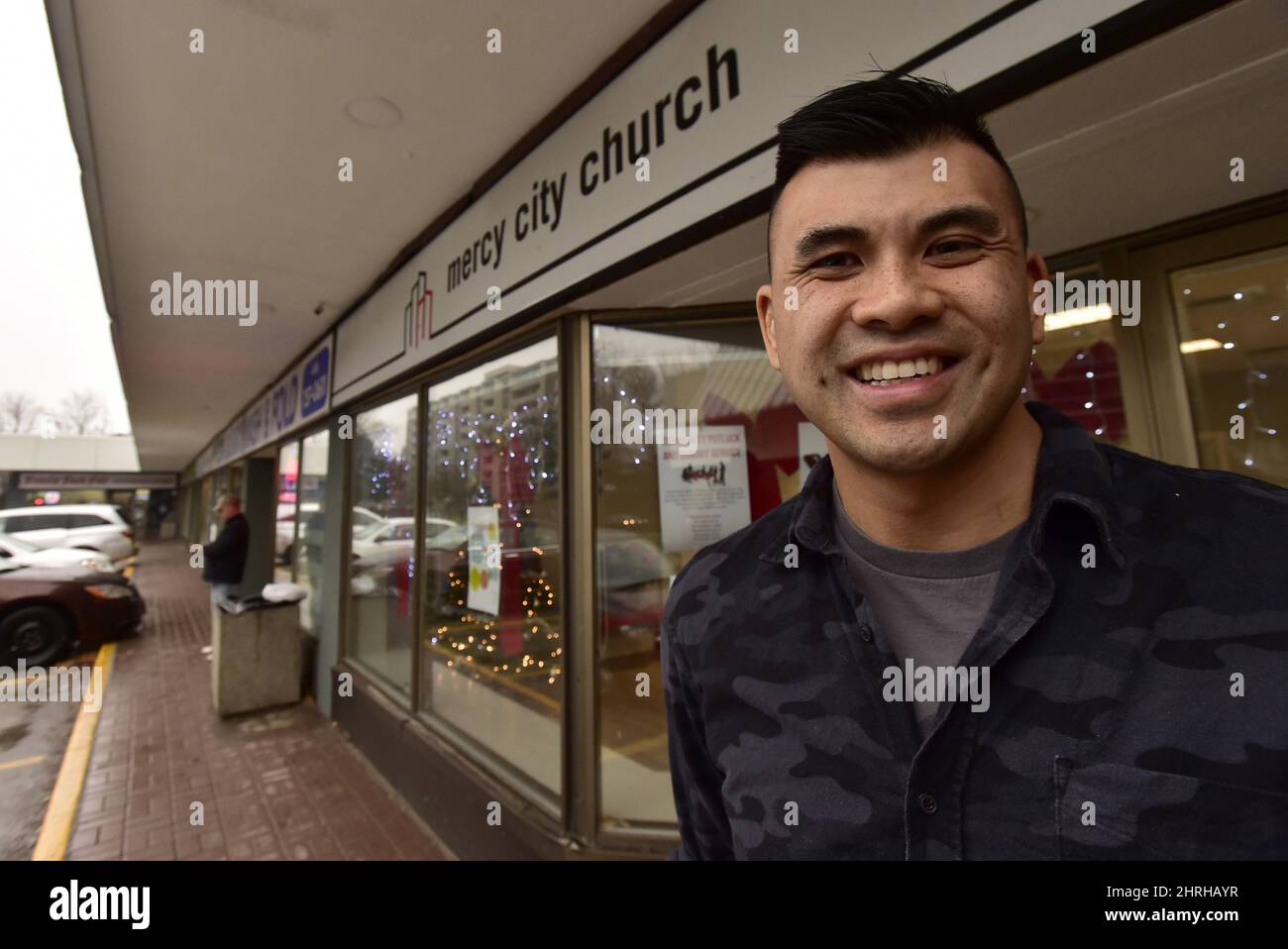 Pastor Chris Yu stands in front of the Mercy City Church in a strip ...