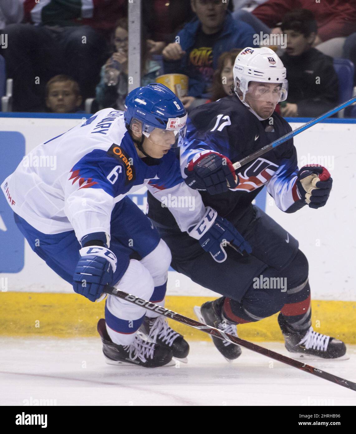 Team U.S.A.'s Evan Barratt fights for control of the puck with Slovakia ...