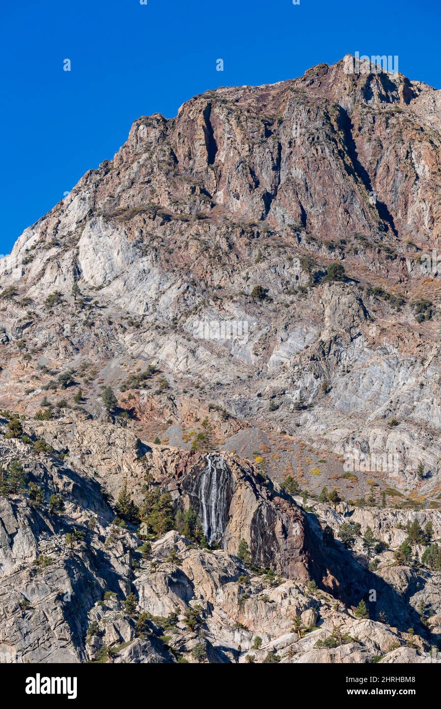 Sunny view of the fall color and waterfall in June Lake Loop at ...