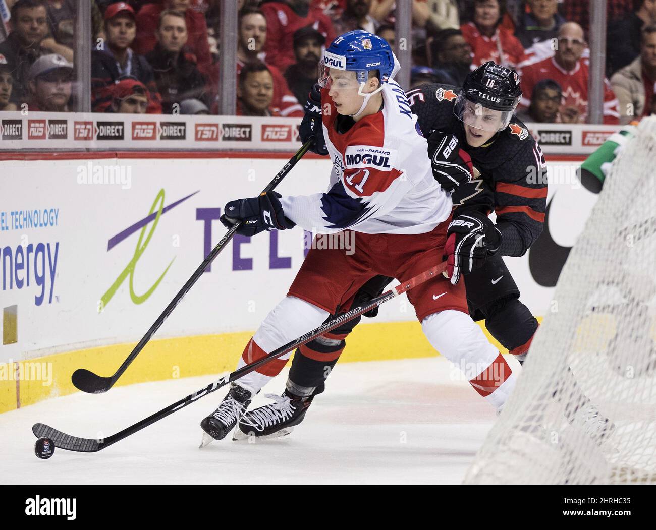 Canada's MacKenzie Entwistle, right, battles for the puck with Czech ...