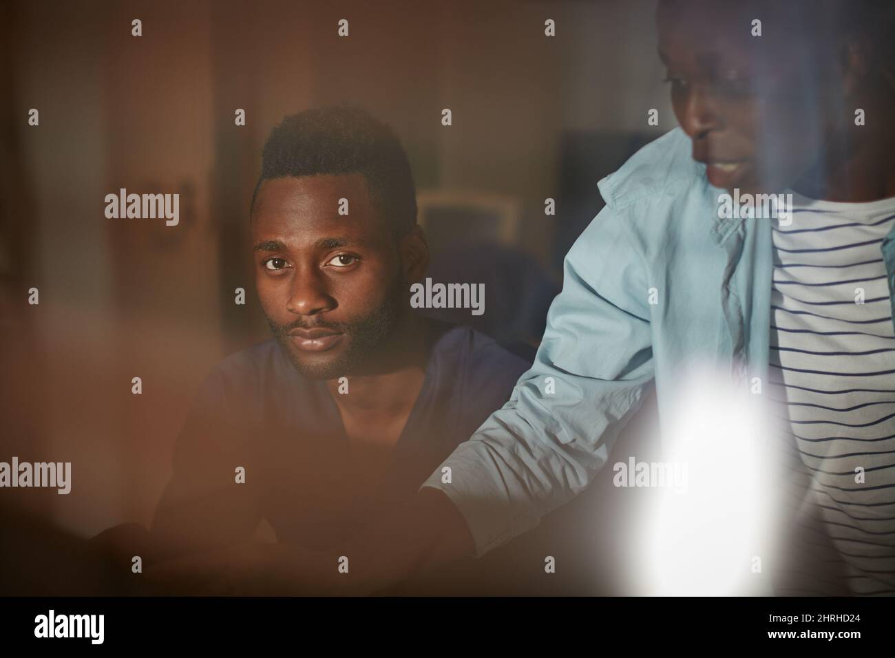 Working the graveyard shift. Cropped shot of doctors working late into ...