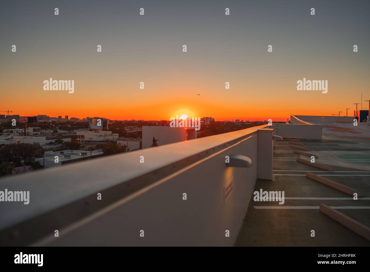 Cityscape view from a roof of a building at sunset Stock Photo - Alamy