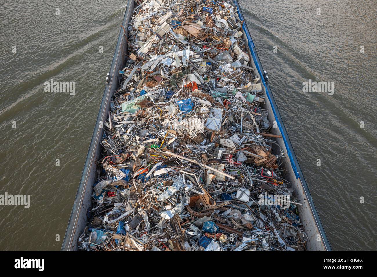 Container of solid waste dumped in a river Stock Photo - Alamy