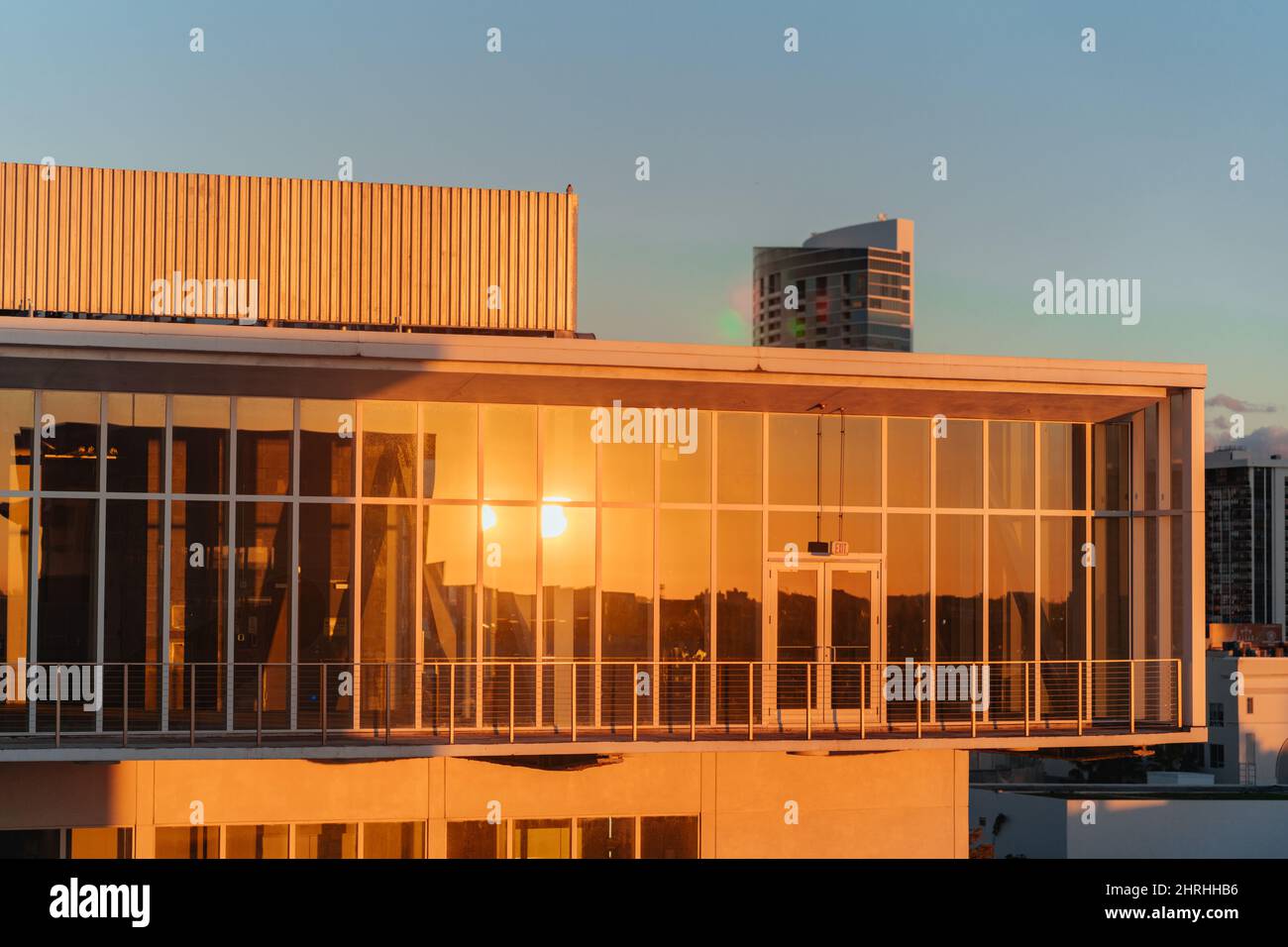 Sunset reflection to the glass of a building Stock Photo - Alamy