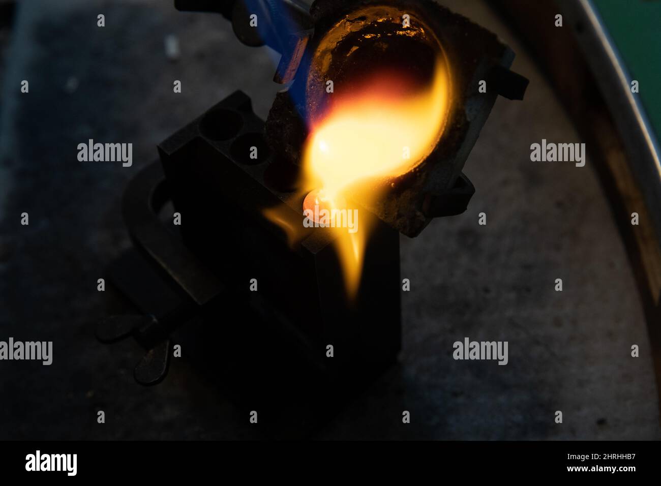 Closeup of hot melted metal in a rusty container in a factory Stock ...