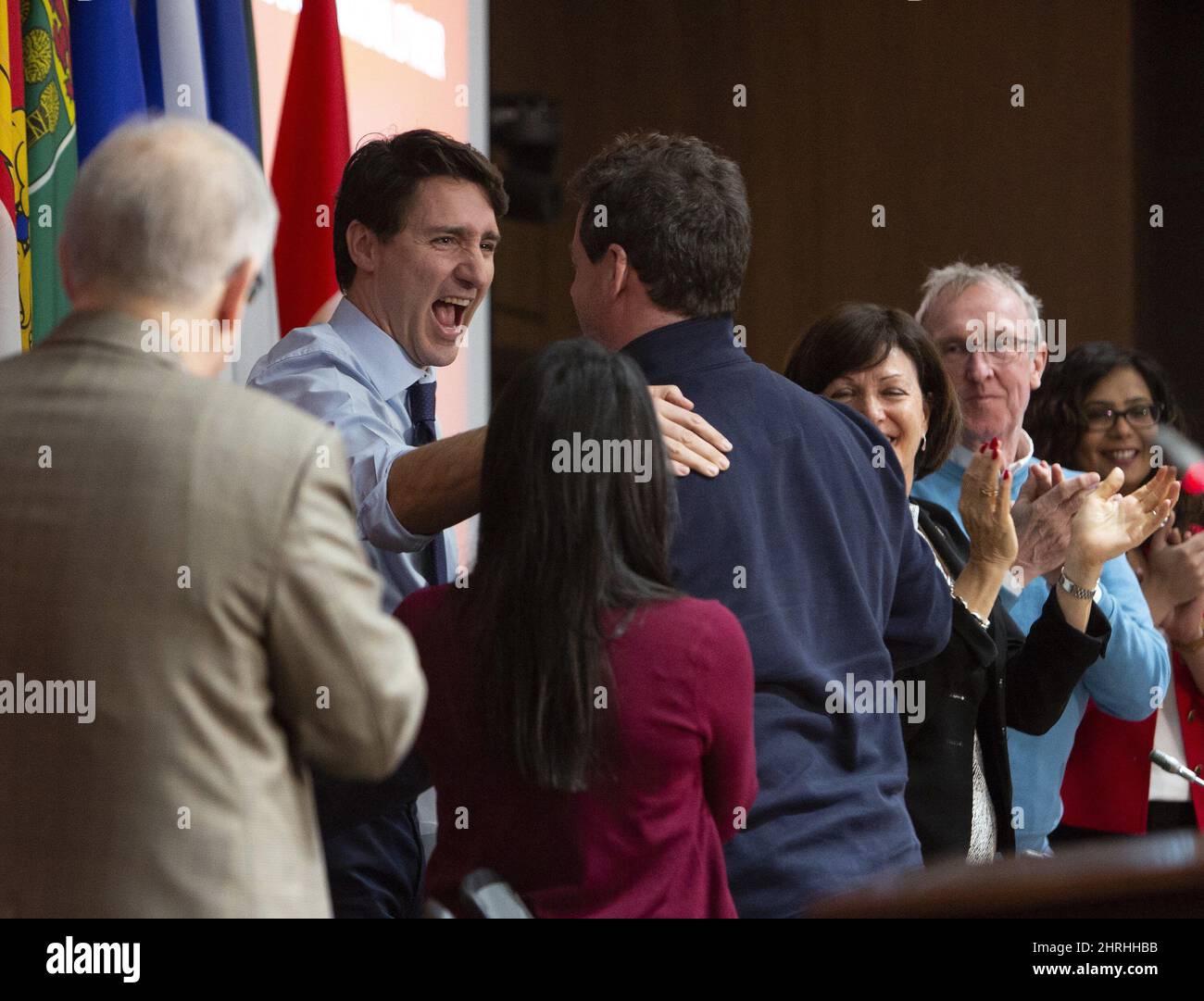 Prime Minister Justin Trudeau is greeted as he arrives for a meeting ...