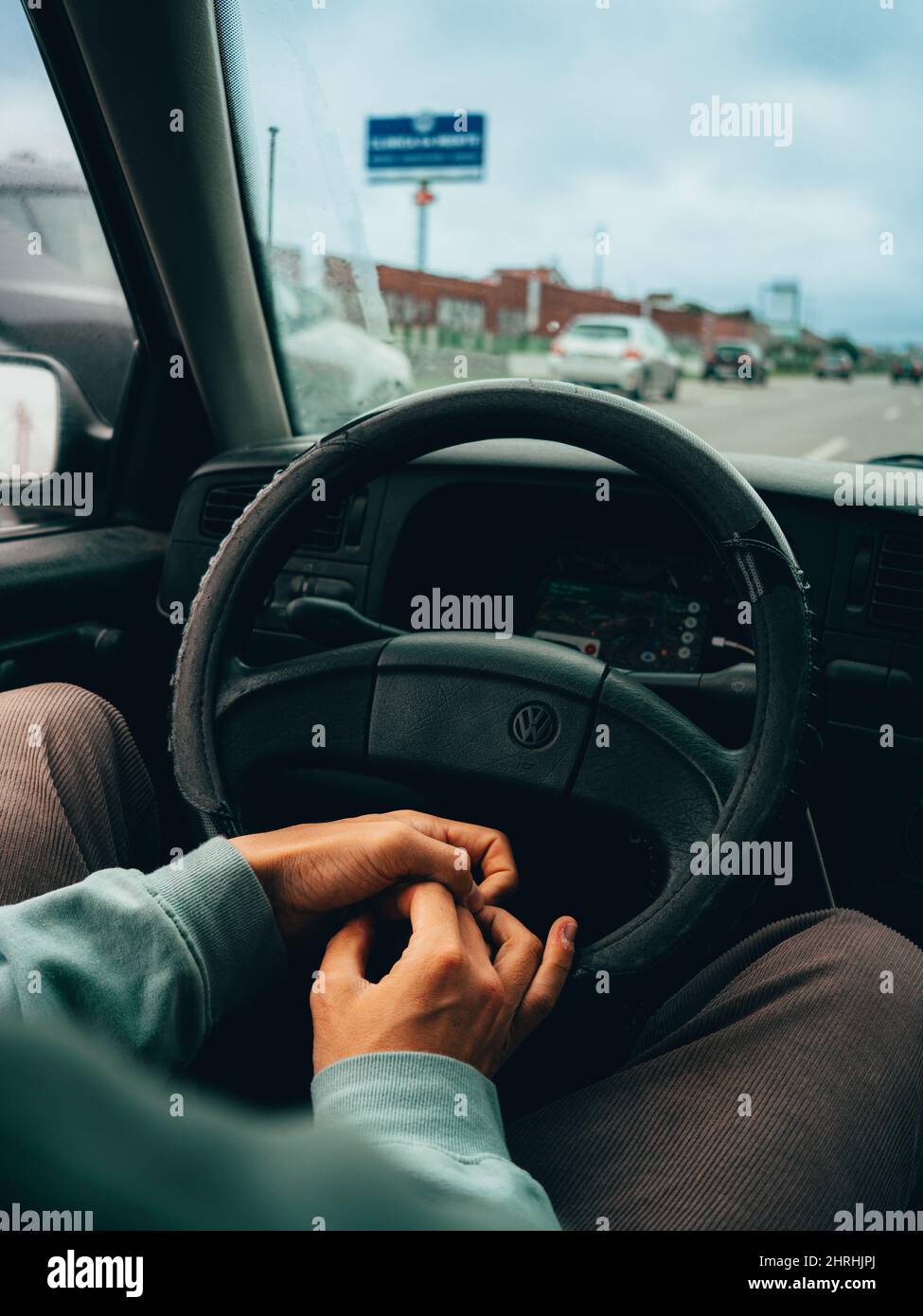 Man behind the car steering wheel in an old Volkswagen Stock Photo - Alamy