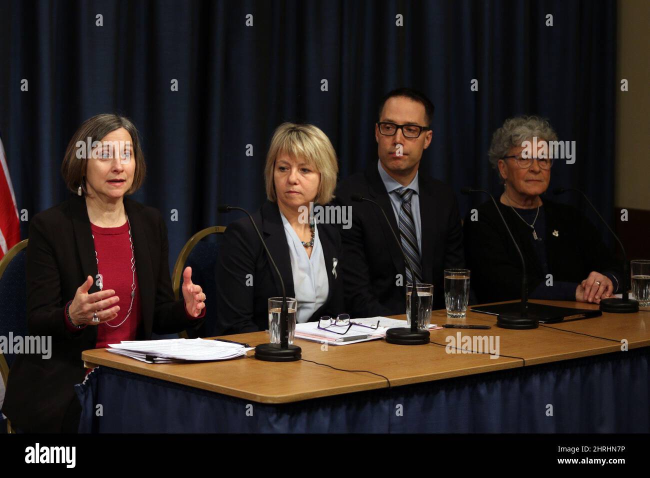 Chief coroner Lisa Lapointe (left to right), answers a question as ...