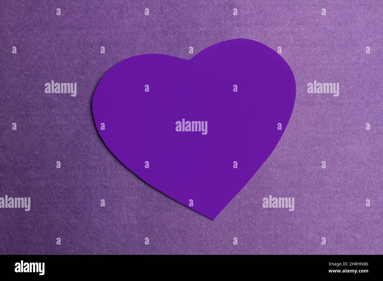 A purple paper heart on a purple background with copy space Stock Photo ...