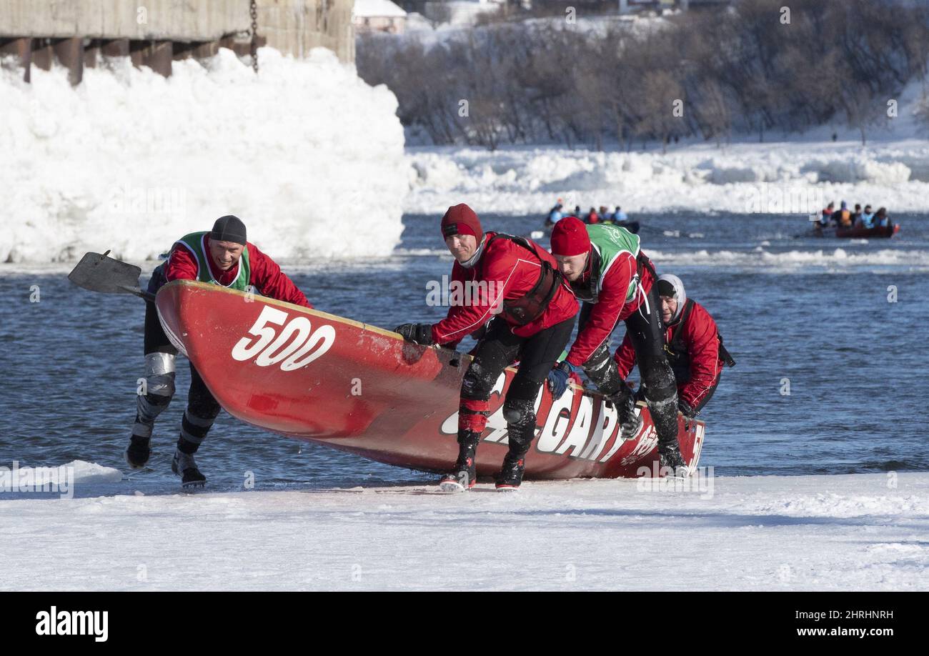 Calgary ice canoe team, skipped by Barney McIlhargey, behind, run on ...