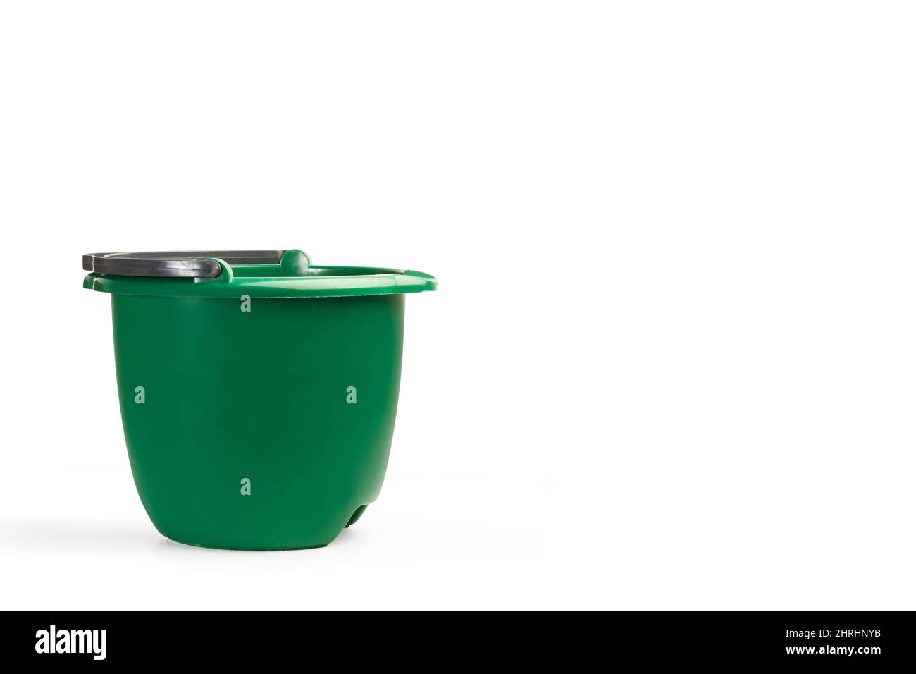 A green cleaning bucket on a white background with copy space Stock ...