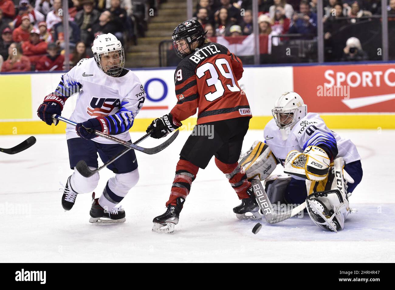 United States goalie Katie Burt (41) makes a save as United States ...