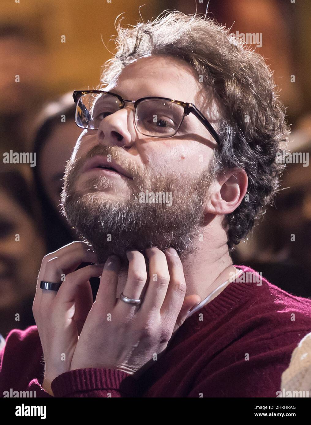 Seth Rogen scratches his beard as he listens during a Canada's Walk of ...