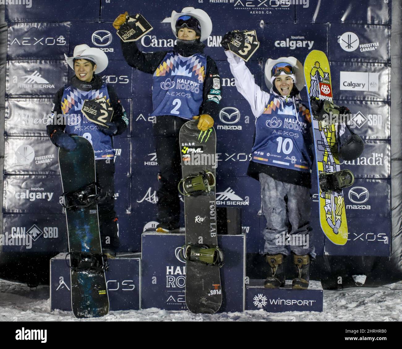 Japan's Yuto Totsuka, centre celebrates his victory with second place ...