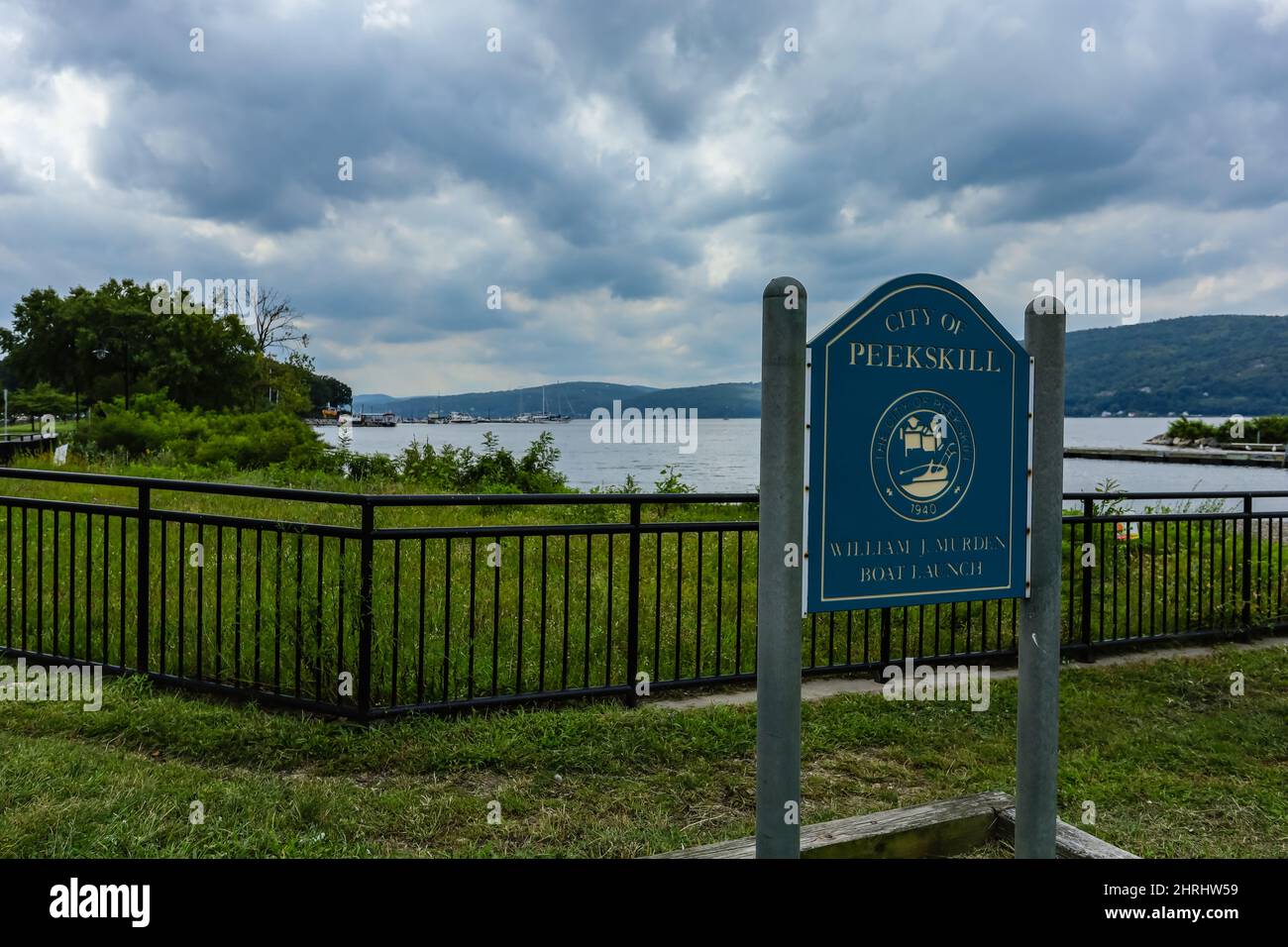 City of Peekskill welcome sign with green waterfront landscape on ...