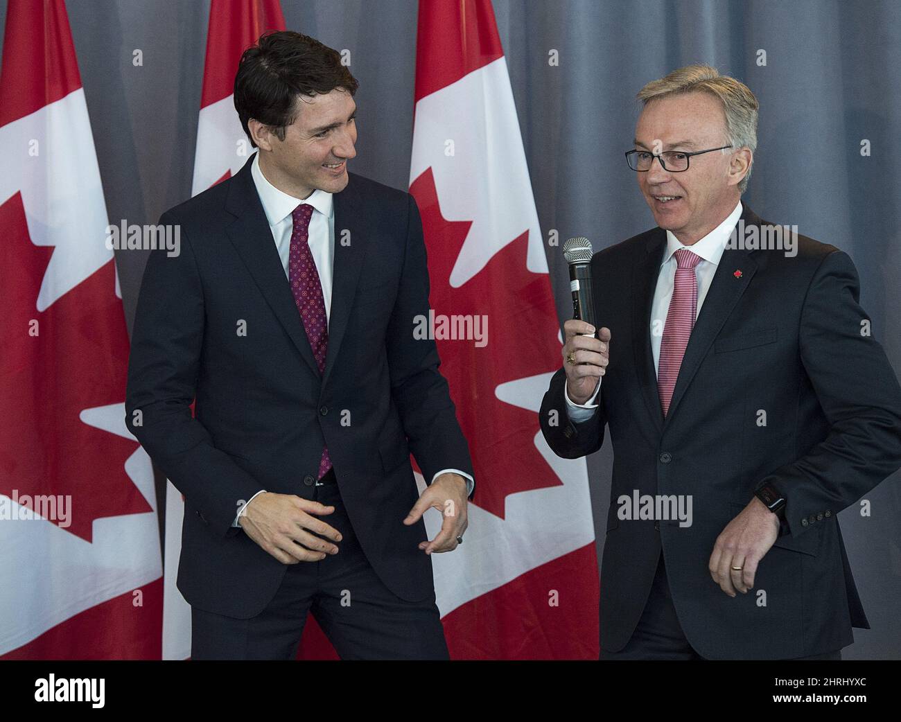 Prime Minister Justin Trudeau, left, chats with Sean Casey, MP for ...