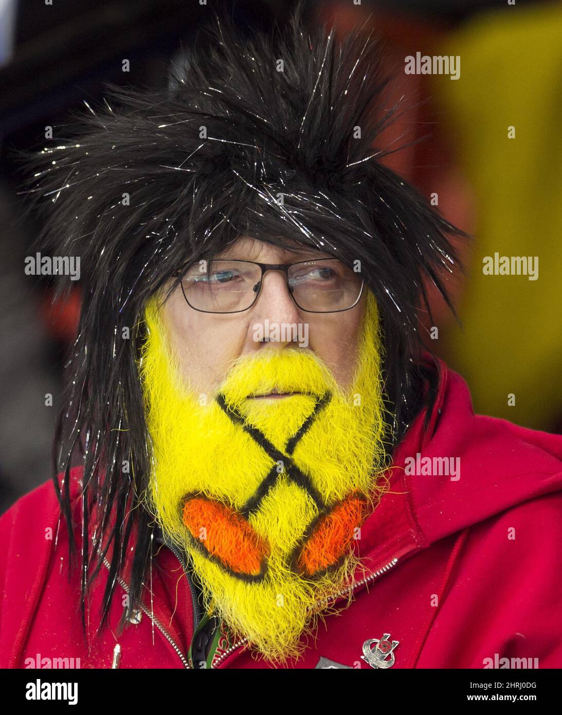 Curling fan Hans Madsen watches the games during the 9th draw at the ...